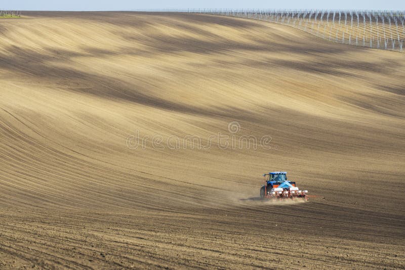 Tractor with Seed Drill in Early Spring Landscape Stock Image - Image ...
