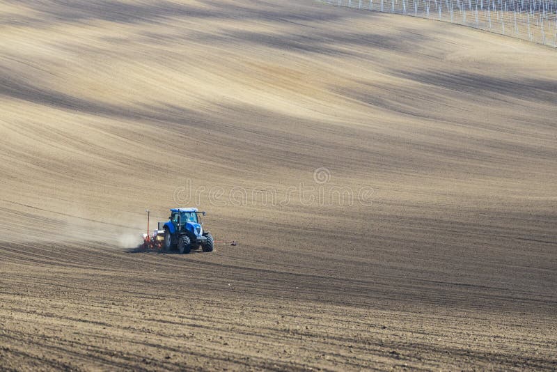 Tractor with Seed Drill in Early Spring Landscape Stock Photo - Image ...