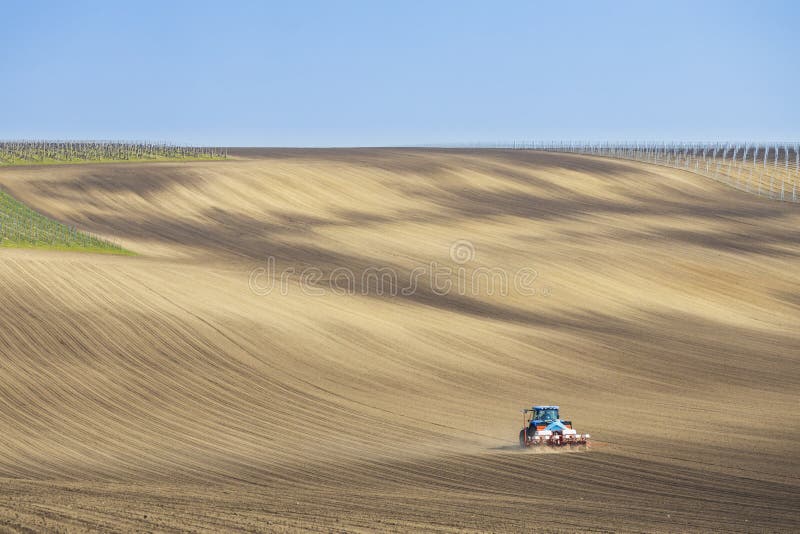Tractor with Seed Drill in Early Spring Landscape Stock Image - Image ...