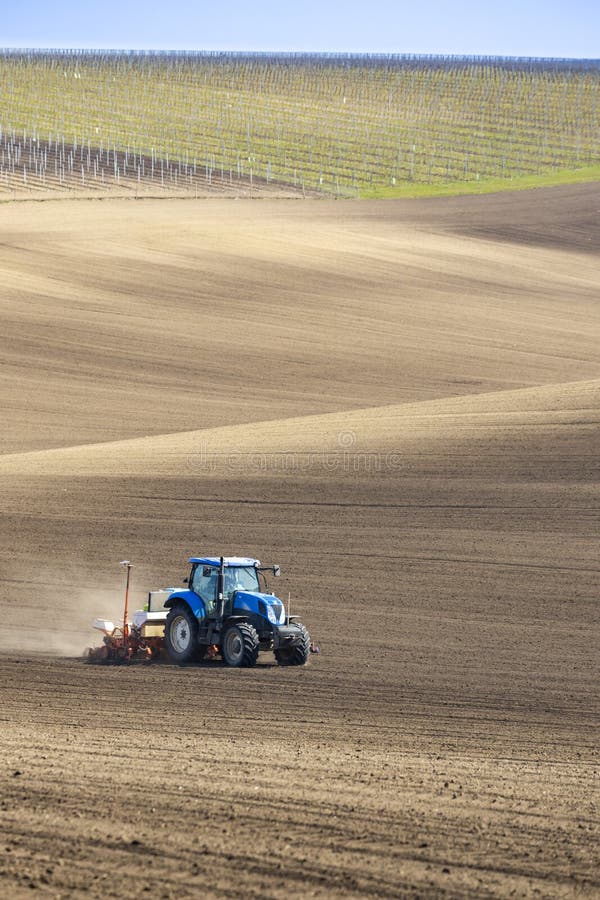 Tractor with Seed Drill in Early Spring Landscape Stock Photo - Image ...
