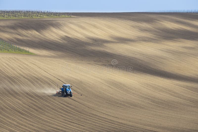 Tractor with Seed Drill in Early Spring Landscape Stock Image - Image ...