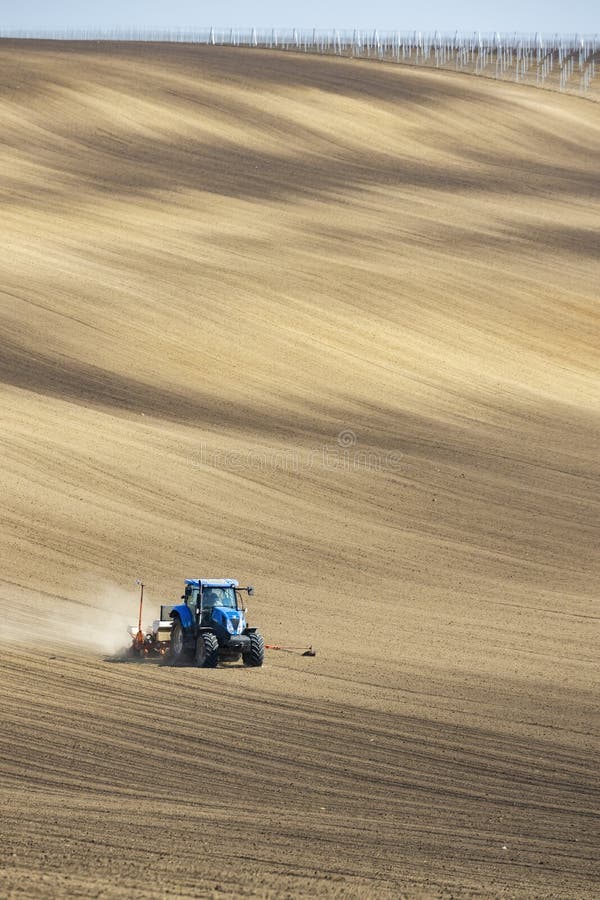 Tractor with Seed Drill in Early Spring Landscape Stock Photo - Image ...