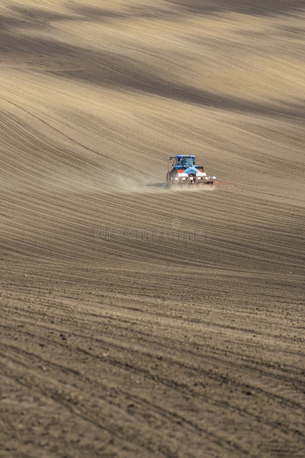 Tractor with Seed Drill in Early Spring Landscape Stock Photo - Image ...