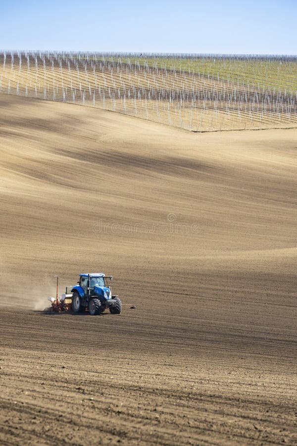 Tractor with Seed Drill in Early Spring Landscape Stock Photo - Image ...