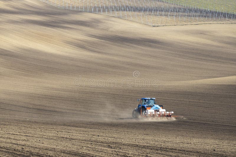 Tractor with Seed Drill in Early Spring Landscape Stock Photo - Image ...