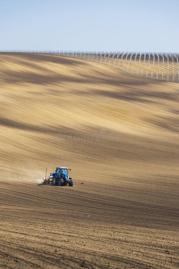 Tractor with Seed Drill in Early Spring Landscape Stock Image - Image ...
