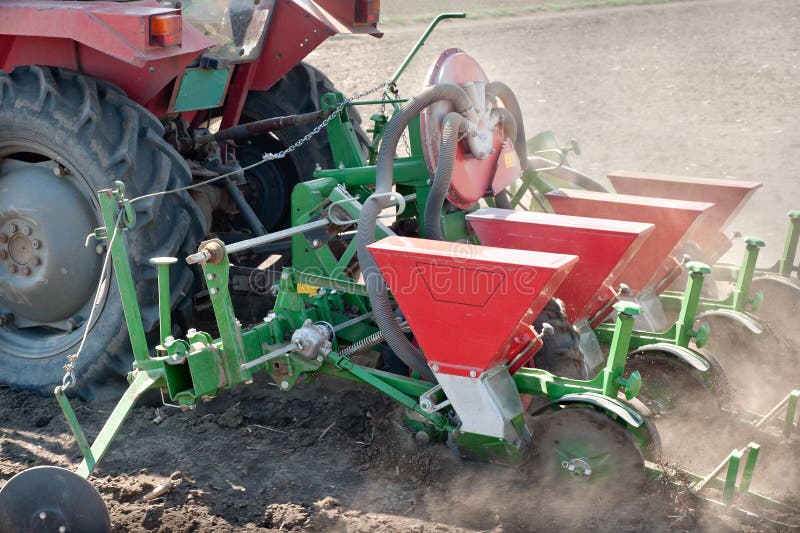 Tractor and Seeder Planting Crops on a Field Stock Photo - Image of ...