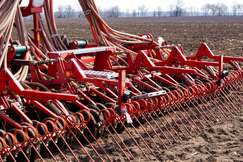 Tractor with Seeder in the Field in Early Spring Stock Photo - Image of ...