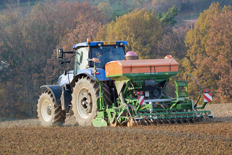 Tractor seeding crops editorial stock image. Image of seeding - 104703074