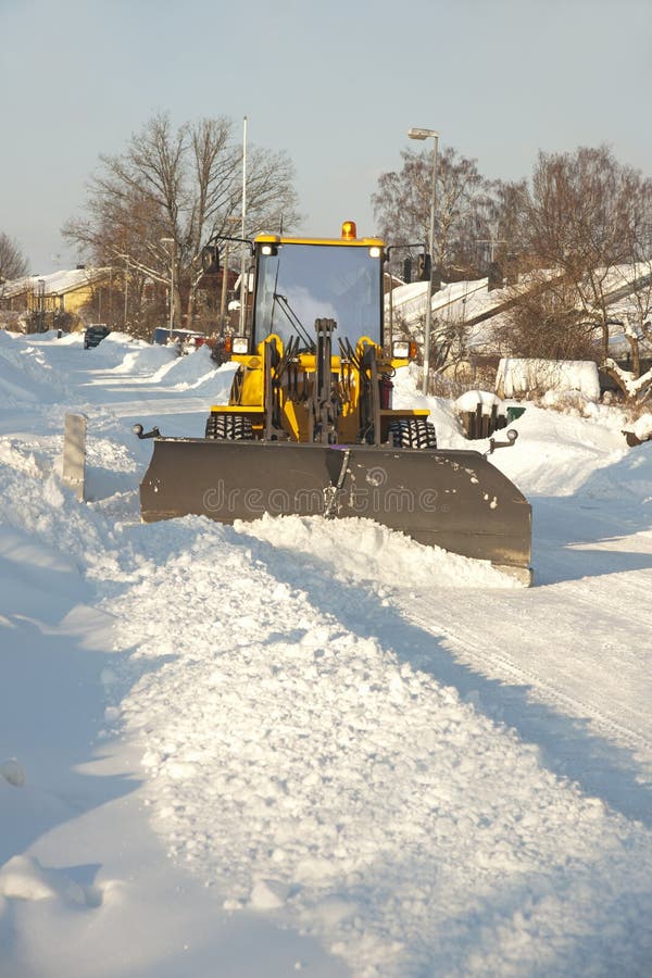 Tractor shoveling snow stock photo. Image of snowstorm - 16352694