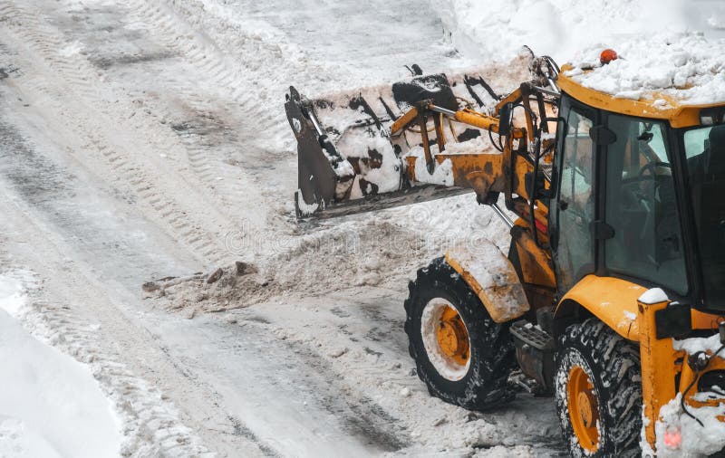Tractor shoveling snow stock image. Image of safety - 264170087