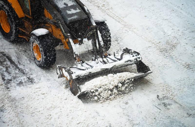 Tractor shoveling snow stock image. Image of lizzard - 300250397