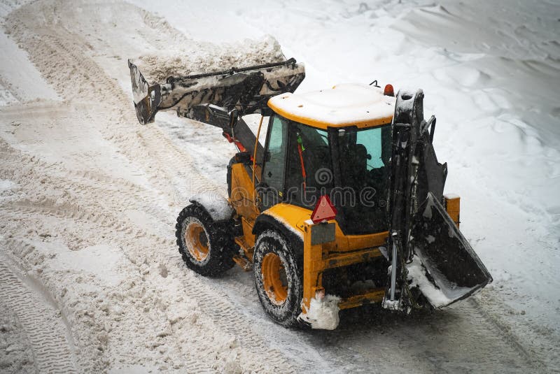 Tractor shoveling snow stock image. Image of danger - 300250409
