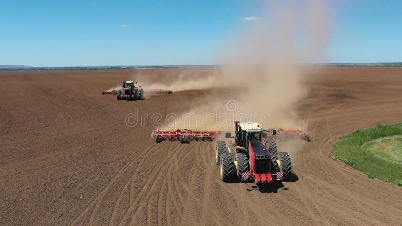 4K. Tractor with a Sowing Complex Works in the Field Stock Footage ...