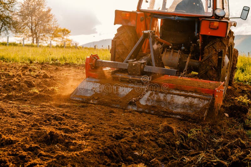 Tractor Sowing Crops at Agricultural Fields in Spring. Stock Photo ...