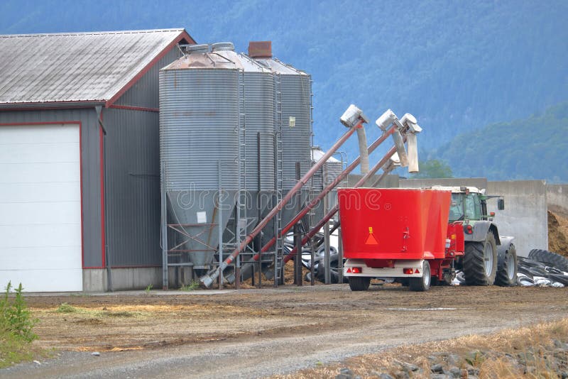 Grain Carrier and Loading Bins on Farm Stock Photo - Image of parked ...