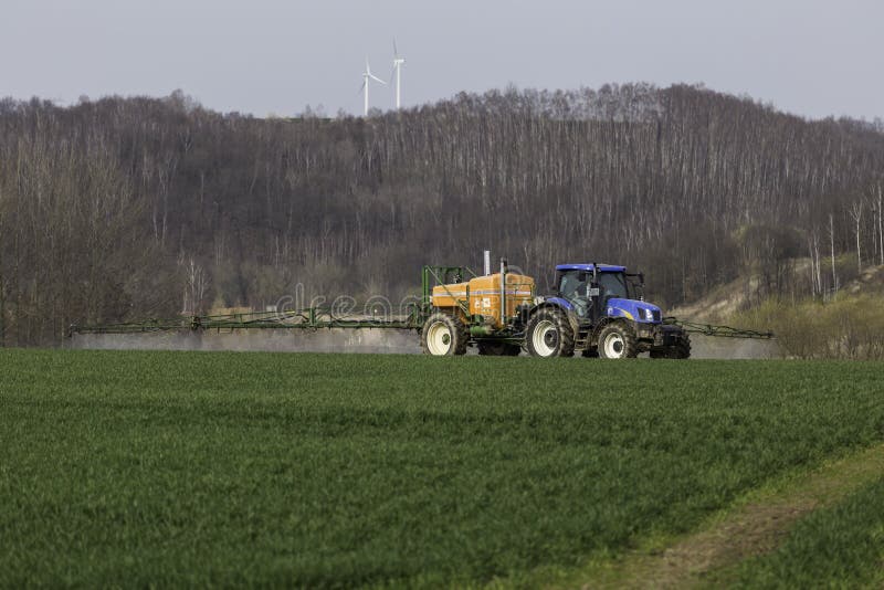 Tractor spraying field stock image. Image of ecology - 84988449