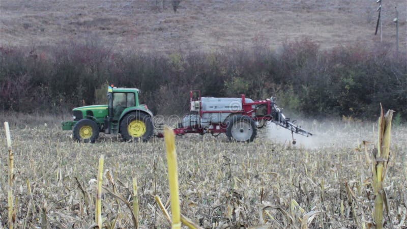 Tractor Spraying Fertilizers with Insecticide Herbicide Chemicals on ...