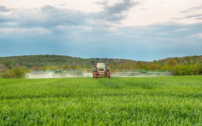Tractor spraying stock image. Image of agricultural, tractor - 83814139