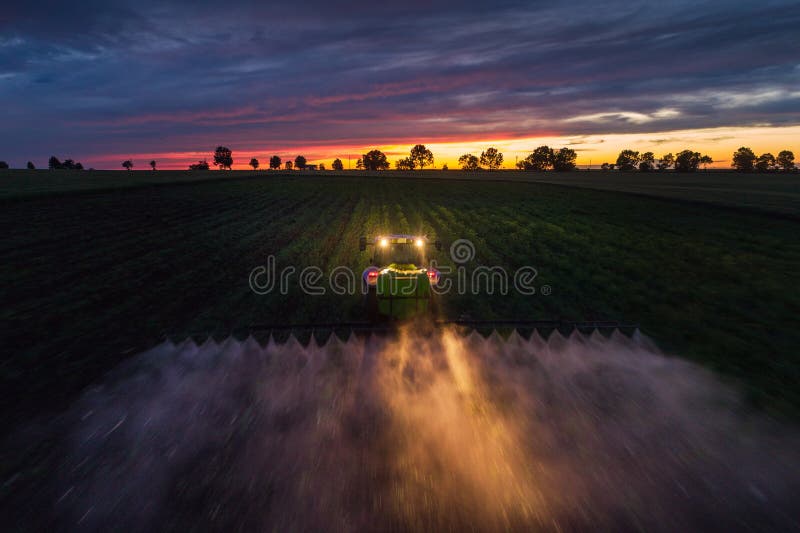 Tractor Spraying Field at Spring,aerial Sunset View Stock Photo - Image ...