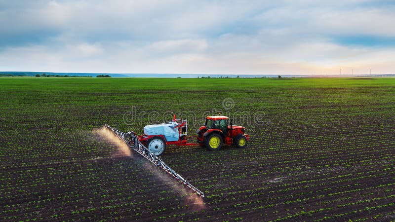 Tractor Spraying Field at Spring Stock Image - Image of plant, farmer ...