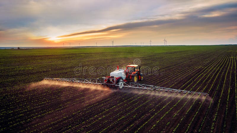 Tractor Spraying Field at Spring Stock Photo - Image of agronomy ...