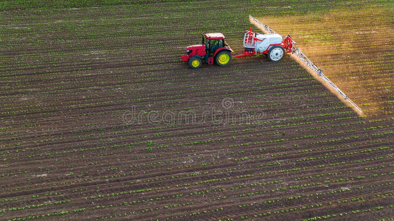 Tractor Spraying Field at Spring Stock Image - Image of agronomy ...