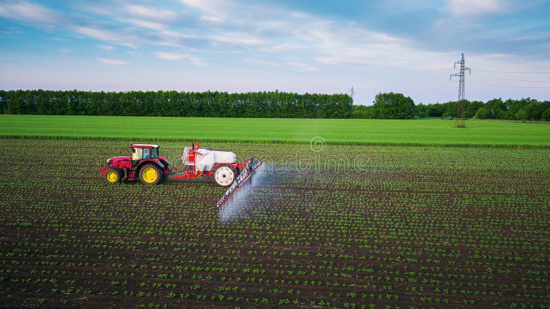 Tractor Spraying Field at Spring Stock Image - Image of land, cultivate ...