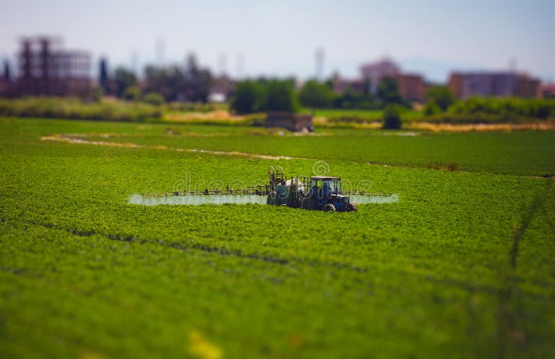 Tractor Spraying Pesticides Editorial Photography - Image of machine ...
