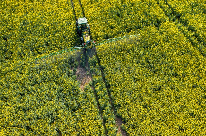 Tractor Spraying on the Field Editorial Photo - Image of biofuel, color ...