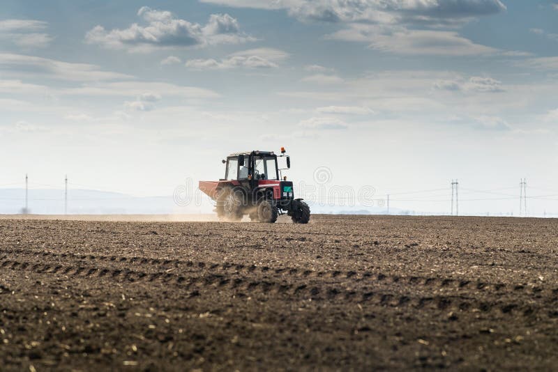 Tractor Spreading Artificial Fertilizers Stock Photo - Image of field ...
