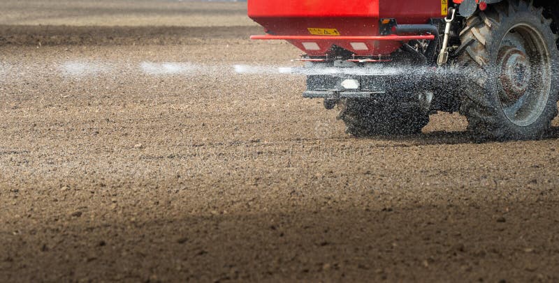Tractor Spreading Artificial Fertilizers Stock Photo - Image of spread ...