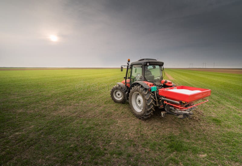 Tractor Spreading Artificial Fertilizers in Field Stock Image - Image ...