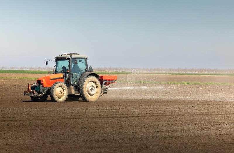 Tractor Spreading Artificial Fertilizers in Field Stock Image - Image ...