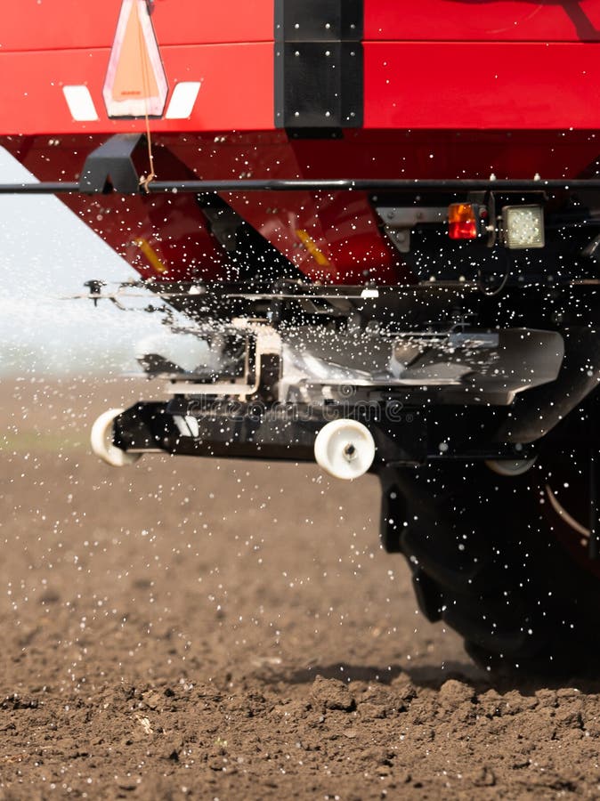 Tractor Spreading Artificial Fertilizers Stock Photo - Image of tire ...