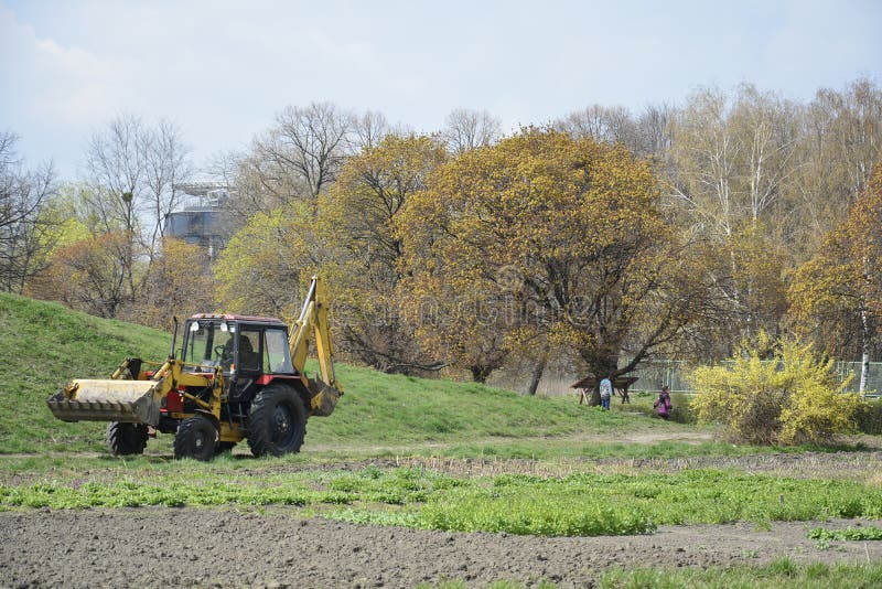 Tractor Spring on the Field. Stock Image - Image of landscape, machine ...