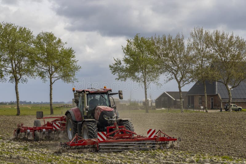 Tractor during Spring Work on the Field Stock Image - Image of plant ...