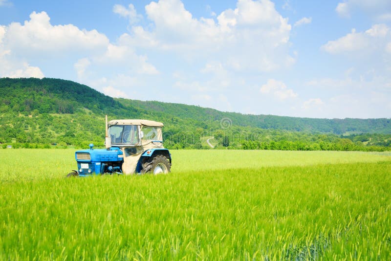 Tractor Standing in a Field Stock Photo - Image of agriculture, germany ...