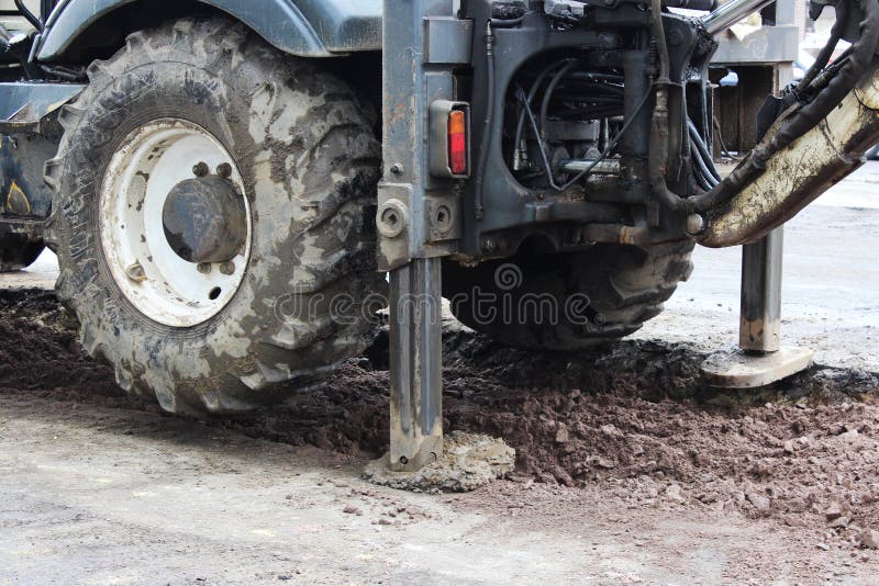 Tractor Strong Outrigger Stabilizing Legs Extended To Stabilize and ...