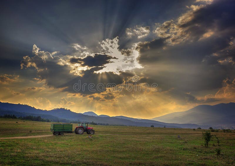 Tractor at sunset stock photo. Image of earthmoving, excavate - 65482410