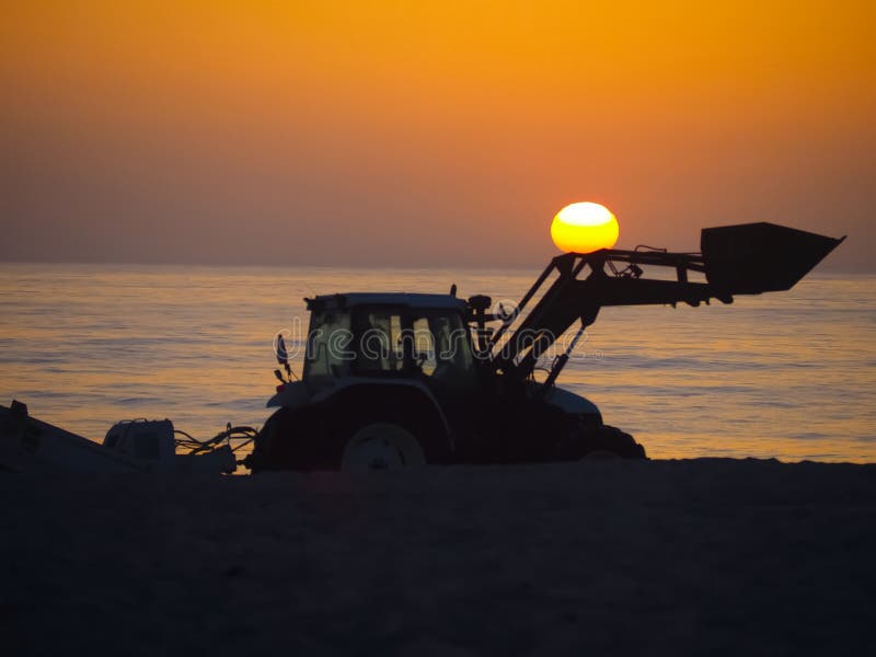 A Tractor at Sunset, Symbolizing Energy and the Sun Stock Image - Image ...