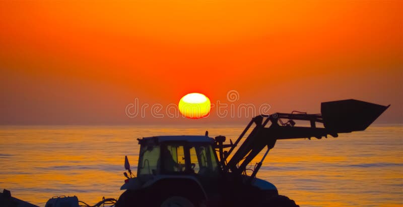 A Tractor at Sunset, Symbolizing Energy and the Sun Stock Photo - Image ...