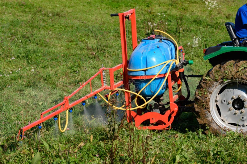 A Tractor with a Tank and Attached Equipment for Spraying the Field ...