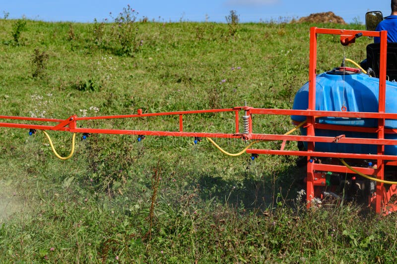 A Tractor with a Tank and Attached Equipment for Spraying the Field ...