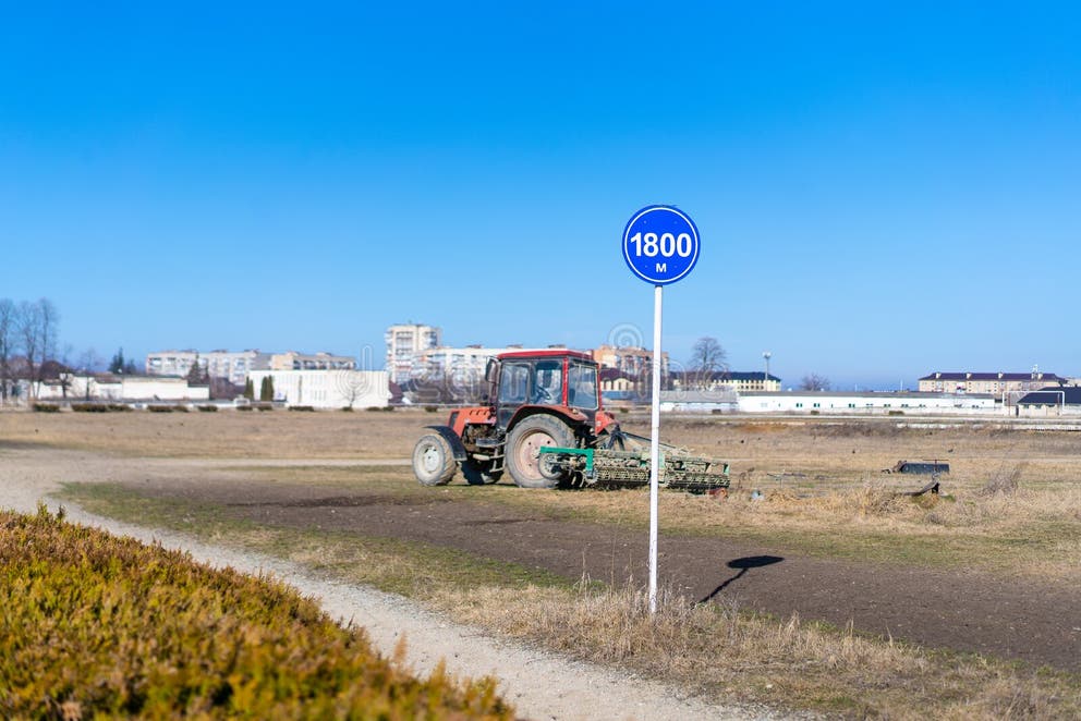 Tractor with a Trailer Plows a Field Editorial Photography - Image of ...