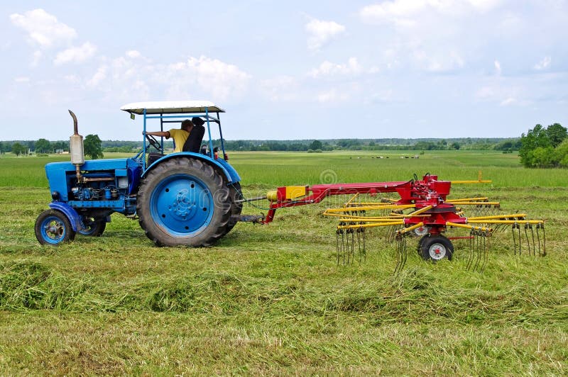 A tractor turning cut hay stock photo. Image of dordogne - 14719388