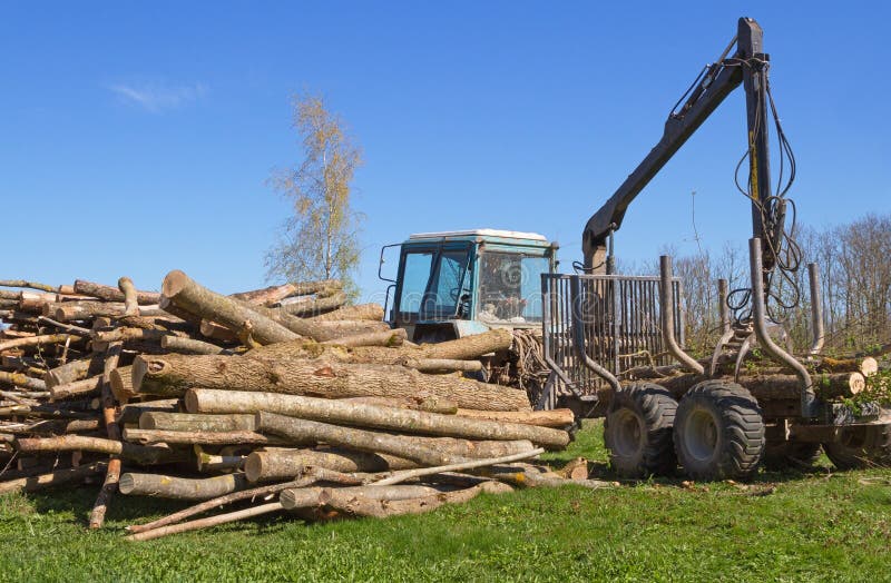 Tractor unload log. stock image. Image of alternative - 67165109