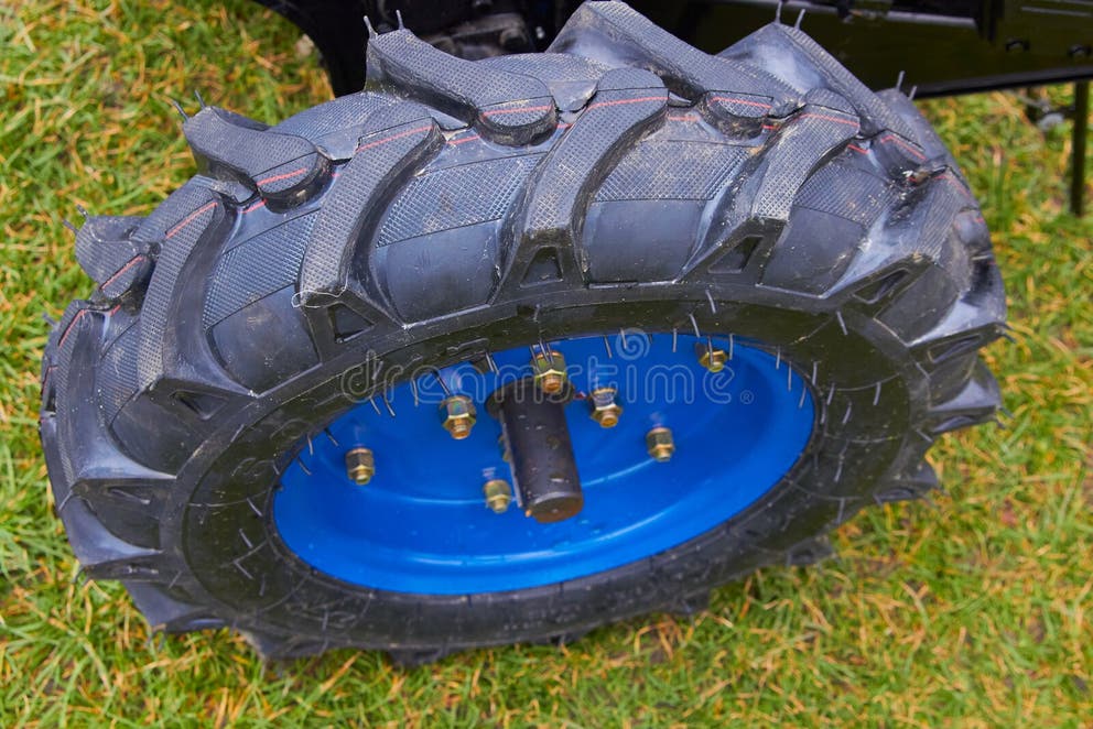 Tractor Wheel on the Grass,a New Wheel on a Tractor Stands on the Grass ...