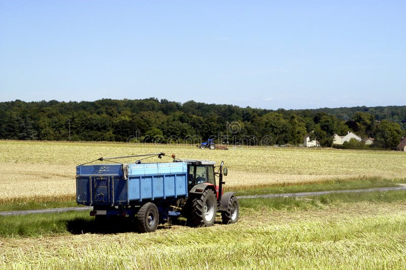 Tractor with Work in a Field Stock Photo - Image of trailer, harvests ...