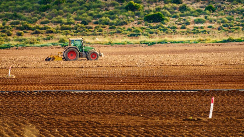 Tractor working on field stock image. Image of farm - 330366365